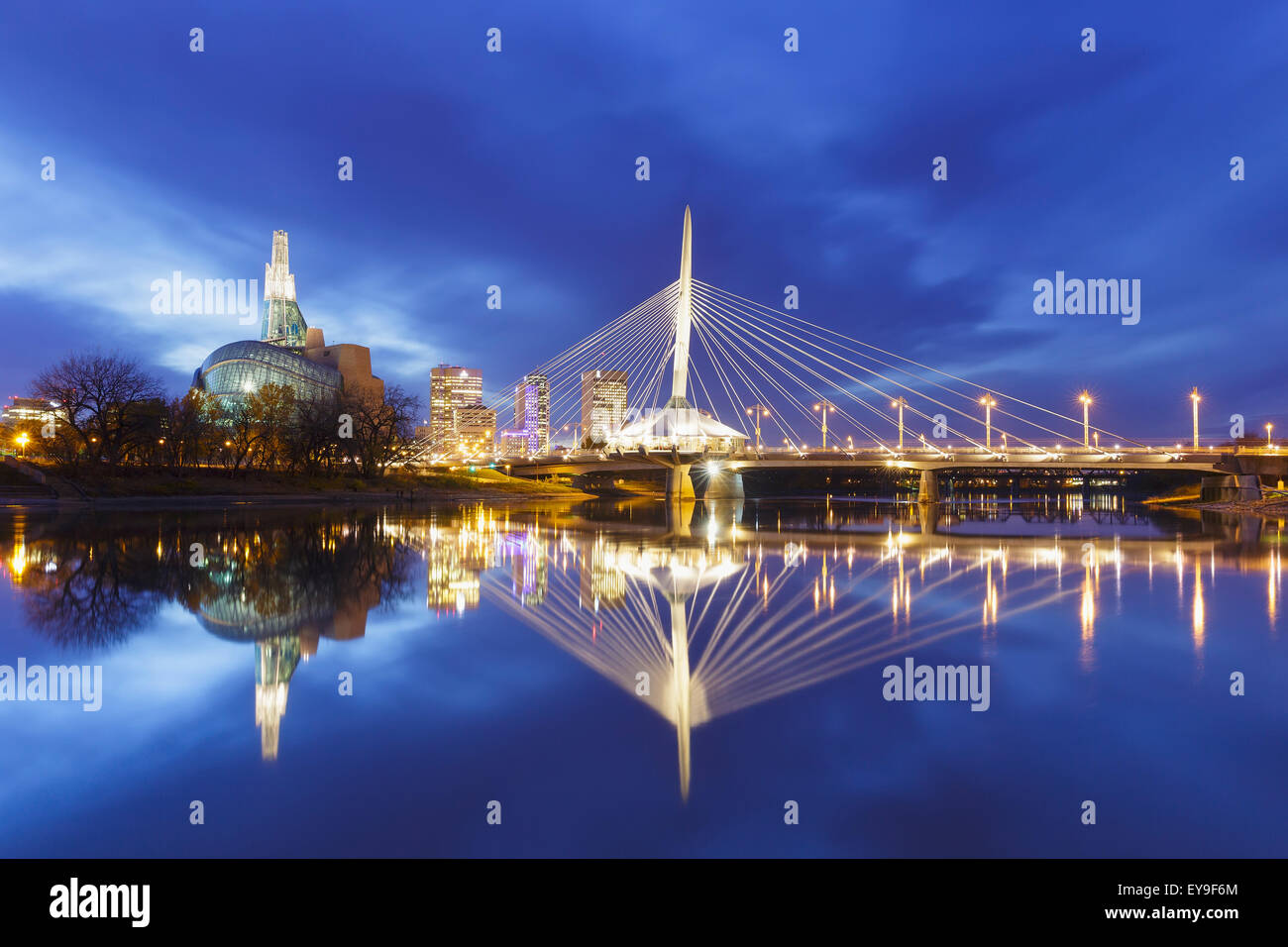 Canadian Museum for Human Rights and Esplanade Riel bridge reflected in ...