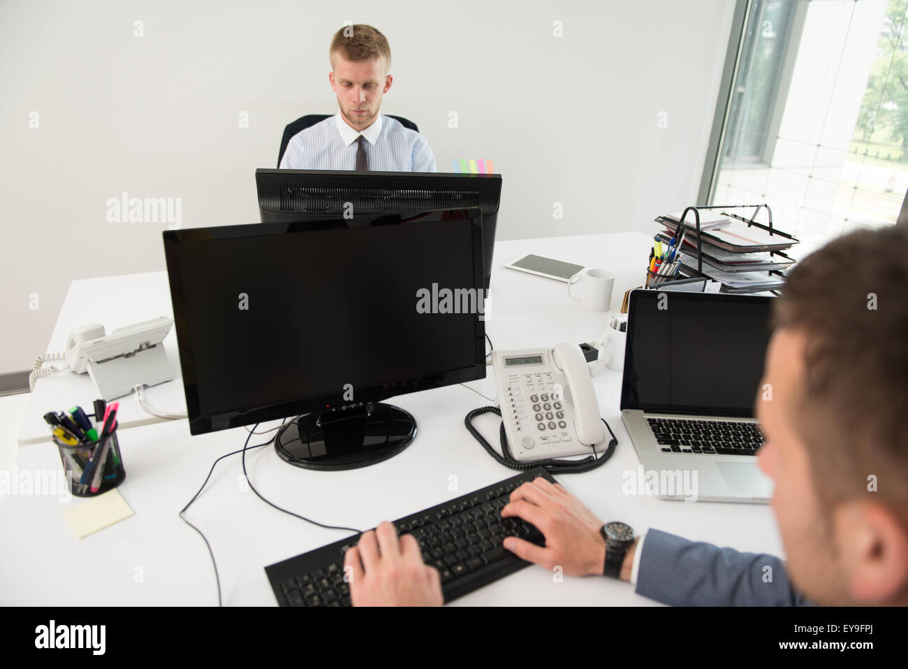 Happy Young Business Men Work In Modern Office On Computer Stock Photo ...