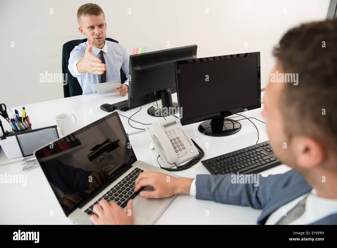 Happy Young Business Men Work In Modern Office On Computer Stock Photo ...