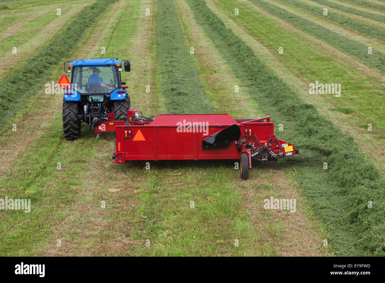 New Holland t5040 with H5430 windrow merger; New Holland, Pennsylvania ...