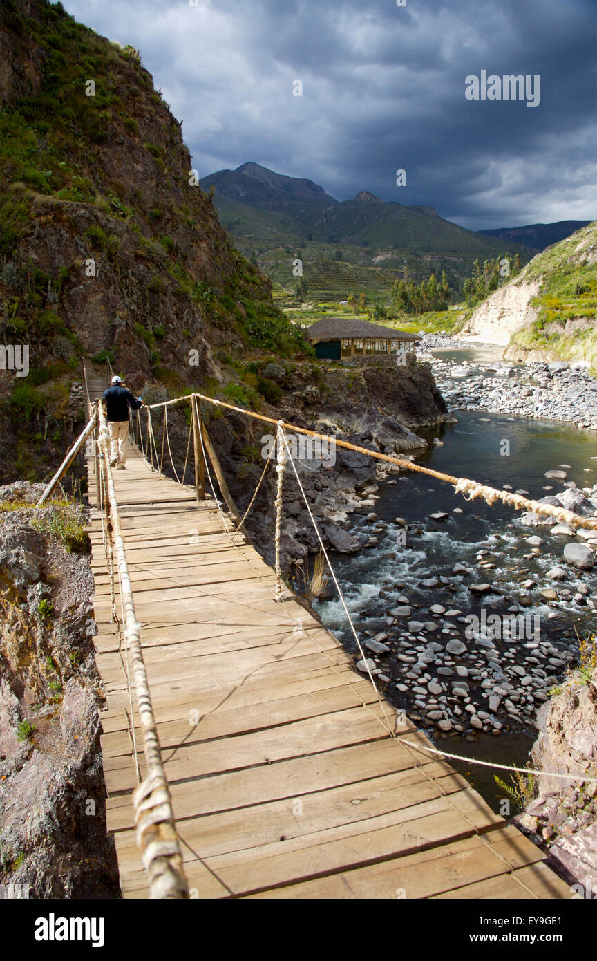 Peru, Person Walking Through Suspension Bridge; Colca Valley Stock ...