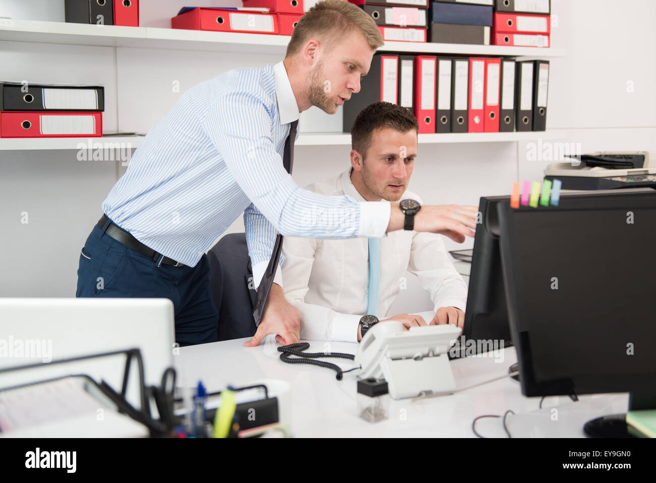 Happy Young Business Men Work In Modern Office On Computer Stock Photo ...