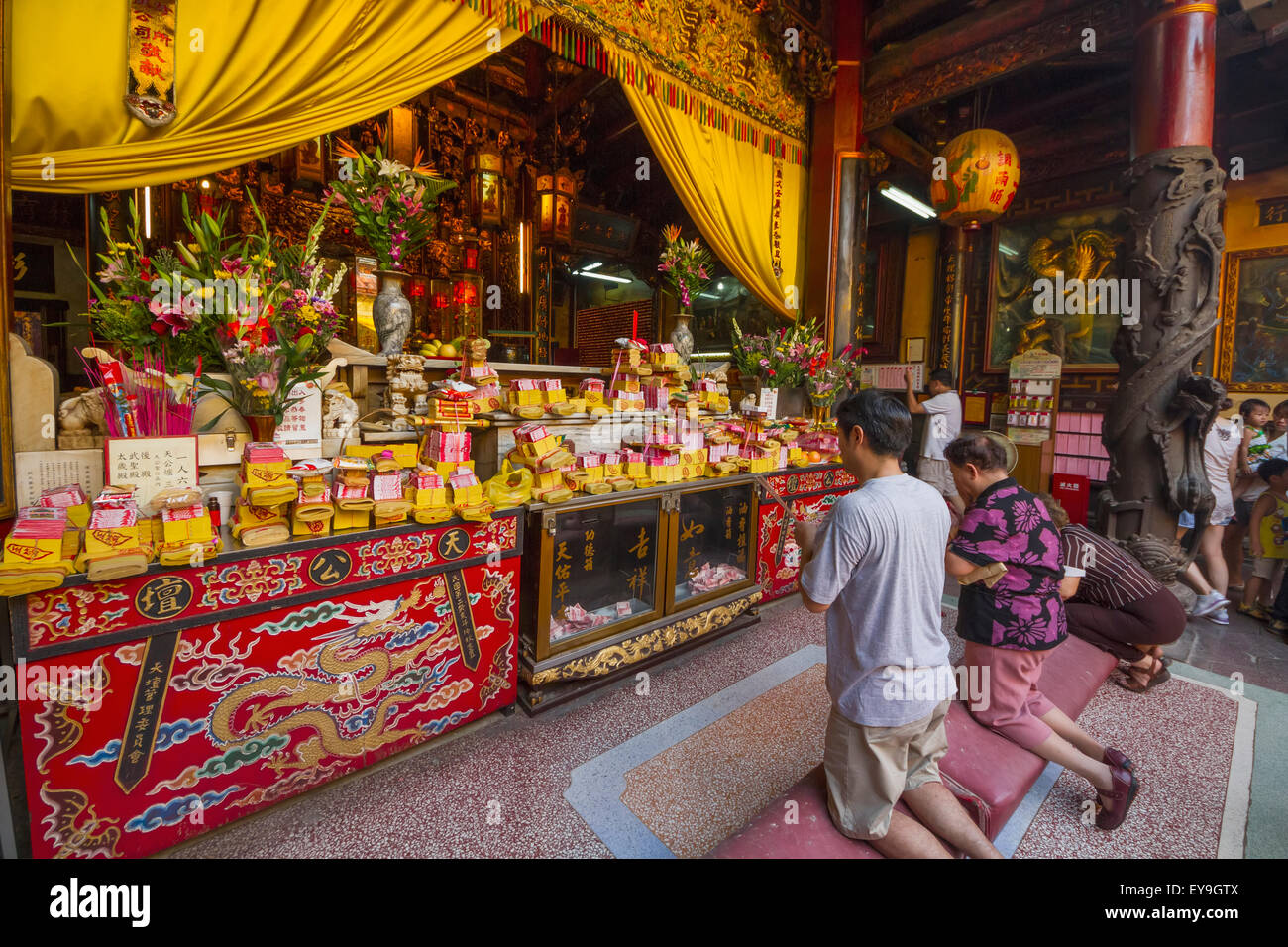 People praying at a shrine in the Altar of Heaven (Tiantan); Tainan ...