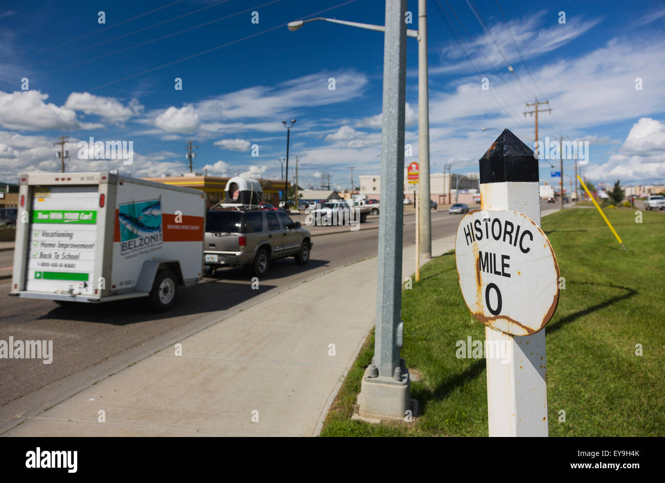 Mile Zero of the Alaska Highway, a car driving by in the background ...
