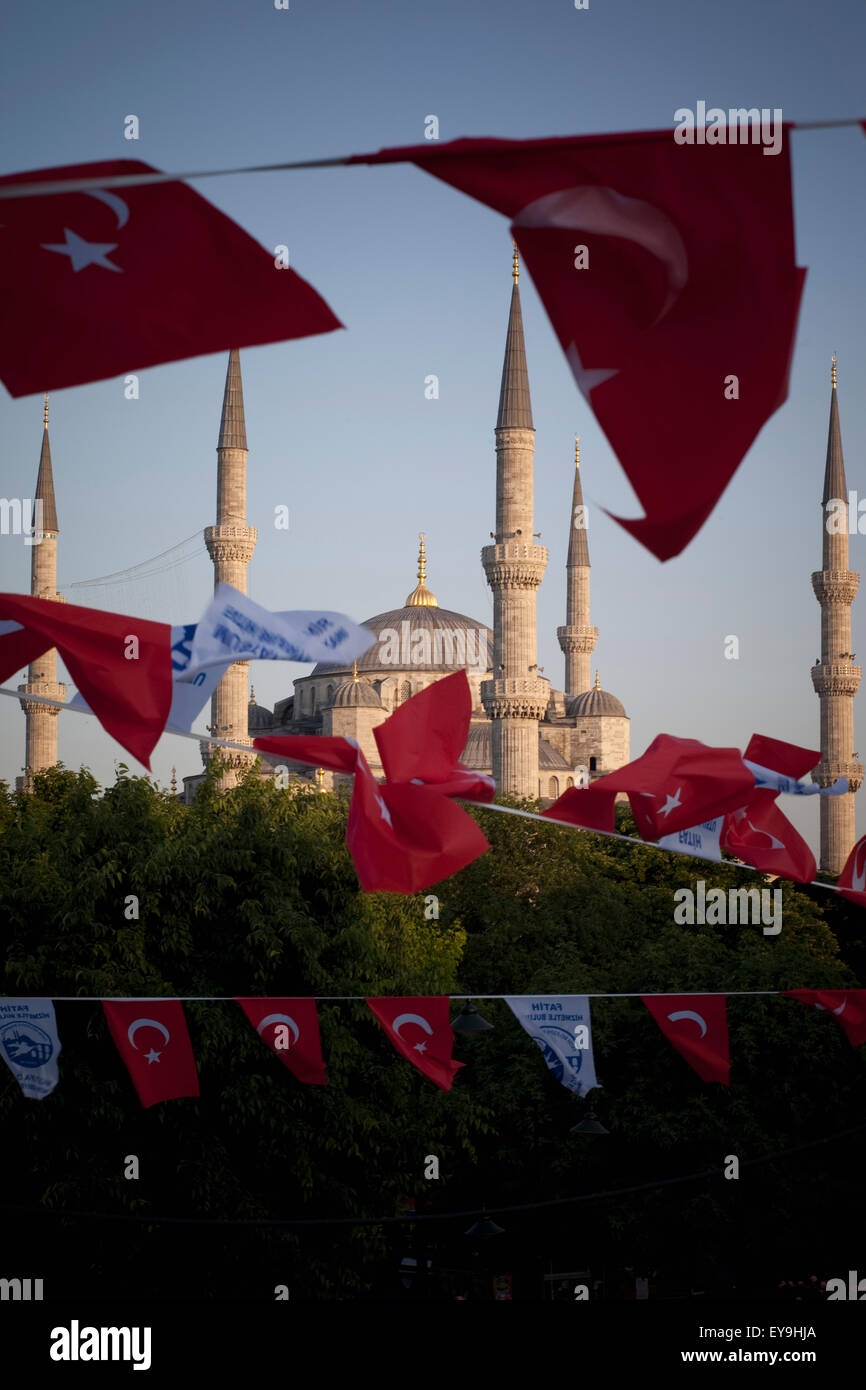 Turkish flags flapping in breeze at dusk over blue mosque hi-res stock ...