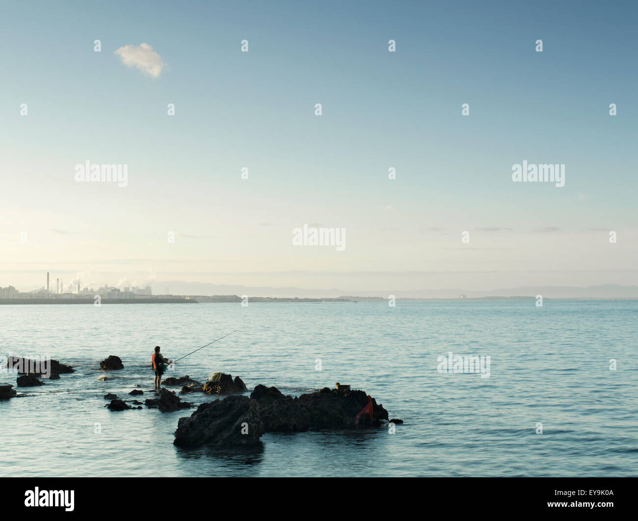 Woman Fishing Off Coast Of Elba Stock Photo - Alamy