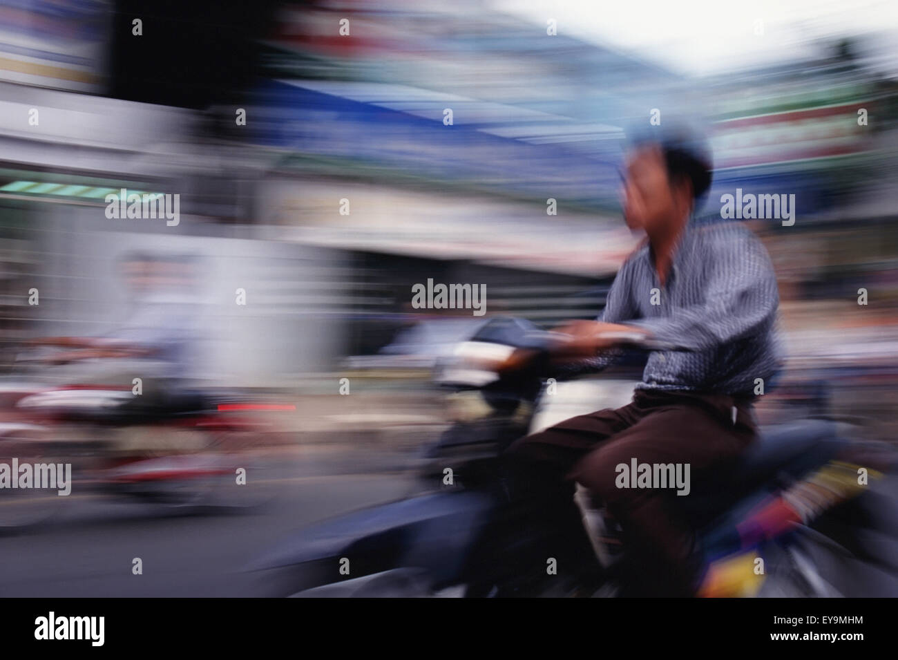 Man Riding Moped In Hanoi, Blurred Motion Stock Photo - Alamy
