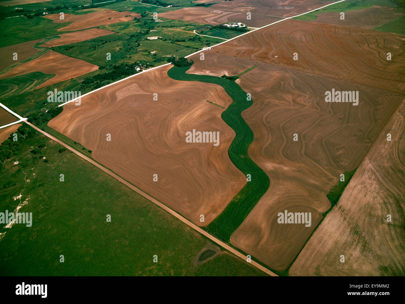 Agriculture - Aerial view of fallow agricultural land with a grassy ... Agriculture - Aerial view of fallow agricultural land with a grassy ...