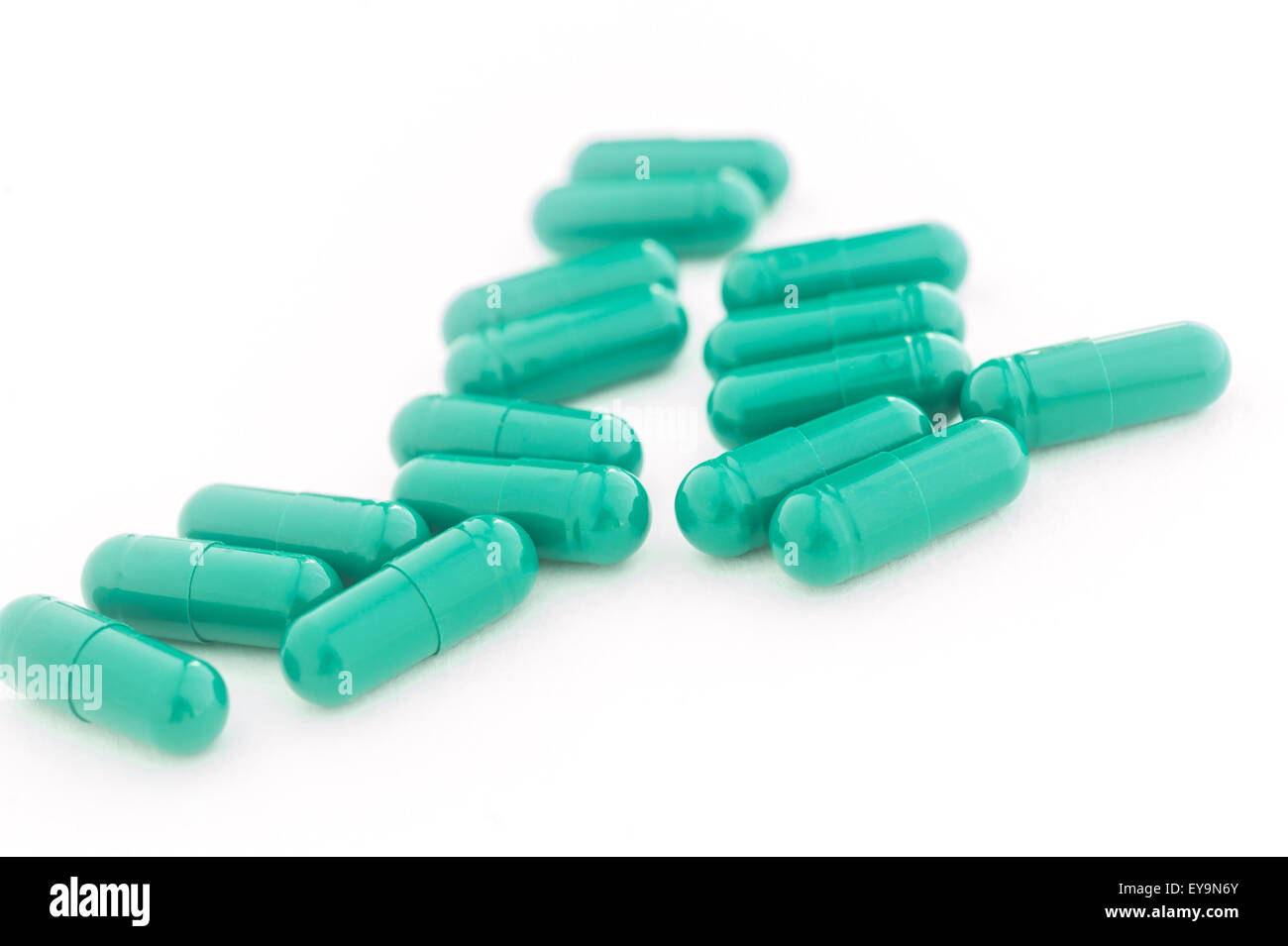 Herb in green capsule on a white background, Herb for health Stock ...