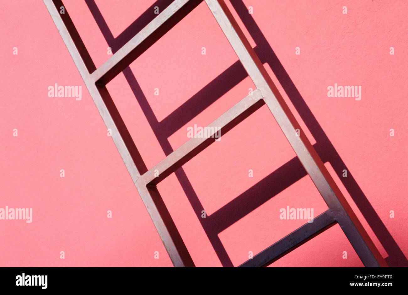 Ladder Leaning Against Red Building Stock Photo - Alamy