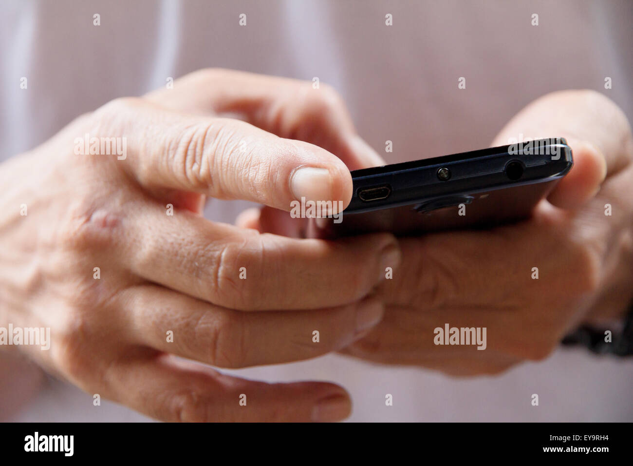 man checking his phone Stock Photo - Alamy