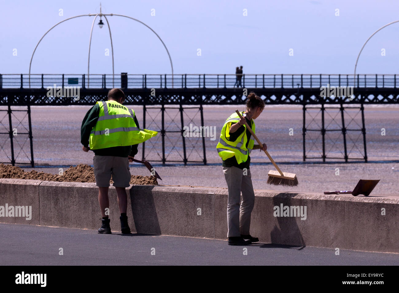 Beach rangers clearing sand build up on Southport seafront Stock Photo ...