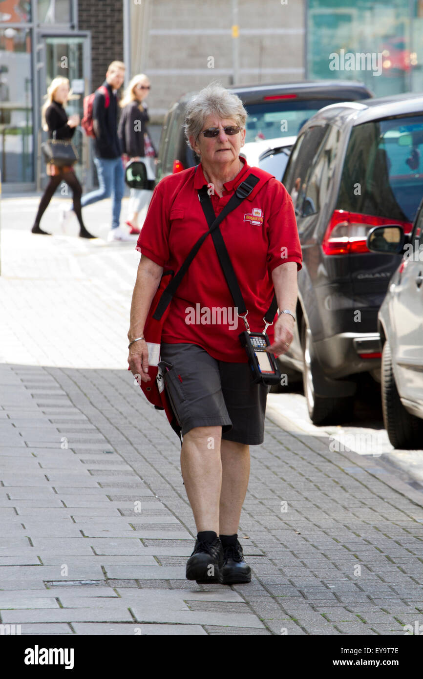 Female postal worker delivery mail, Blackpool, Fylde, UK Stock Photo ...