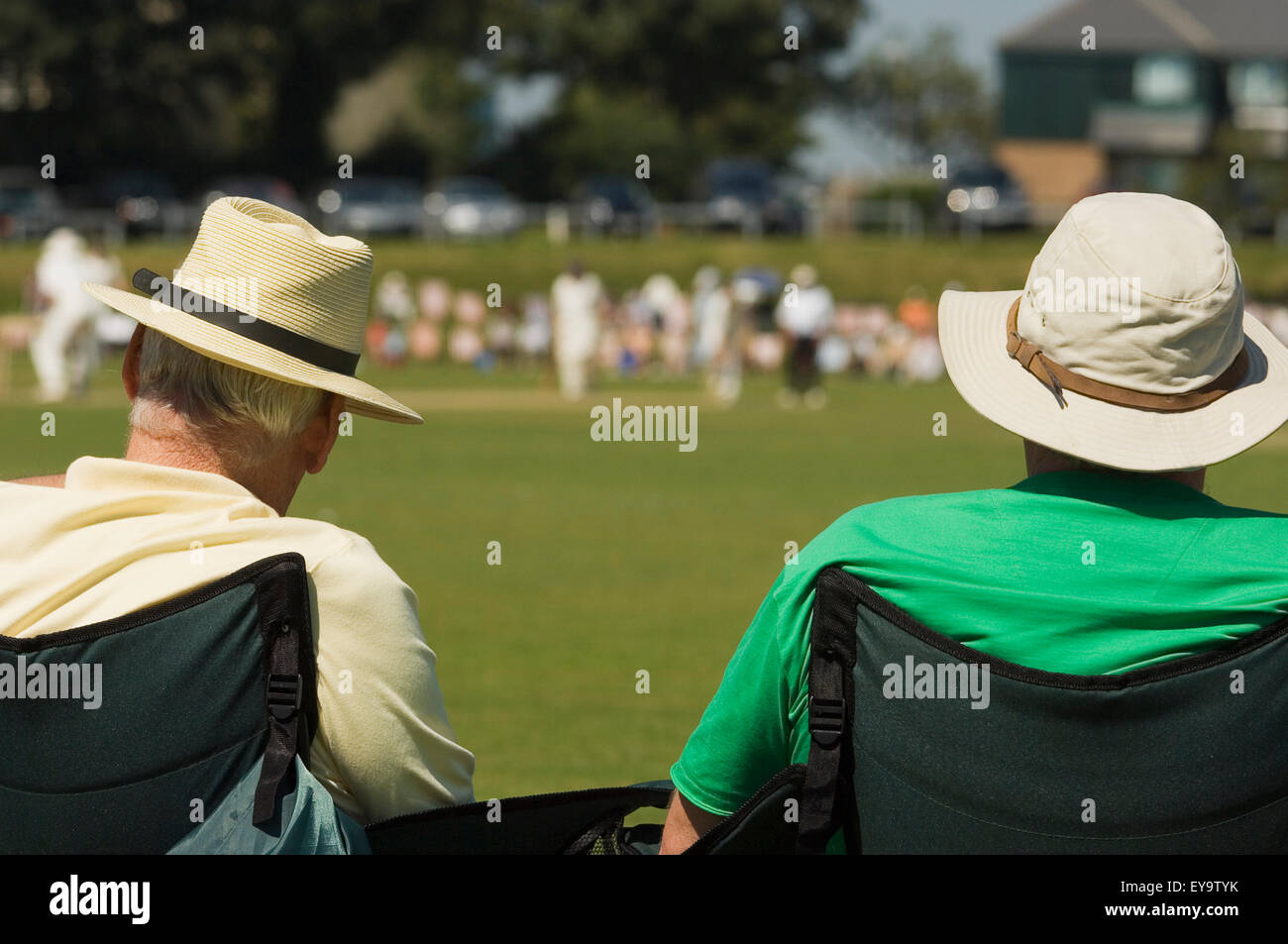 Rear View Of Spectators Watching A Cricket Match On A Hot Summers Day ...
