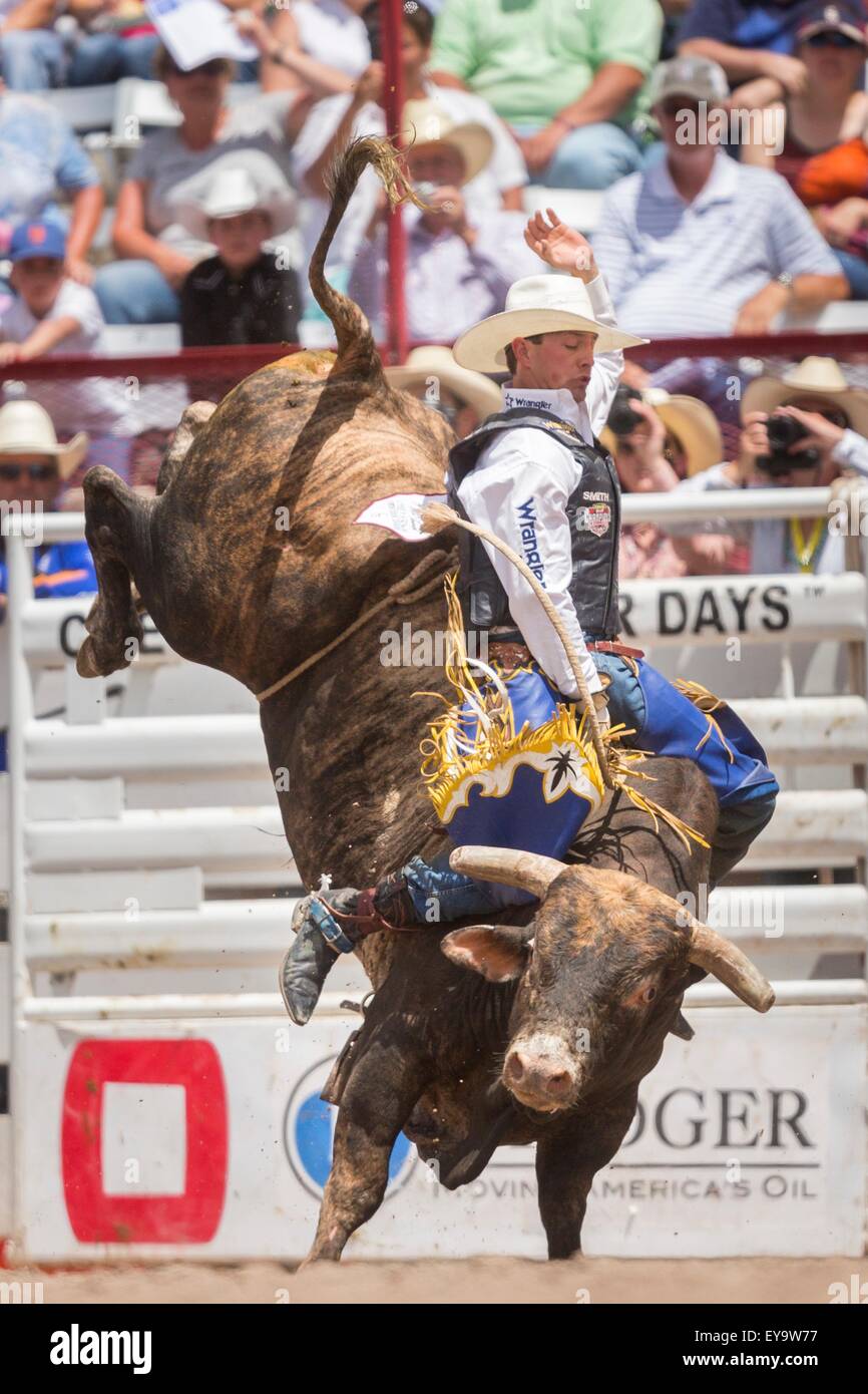 Cowboy riding bucking bull in rodeo High Resolution Stock Photography ...