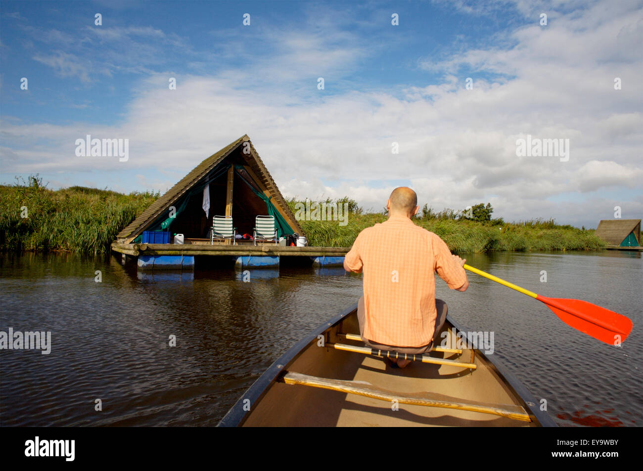Holland, Man In Boat And Camping Raft In Background; DeHeen Stock Photo ...