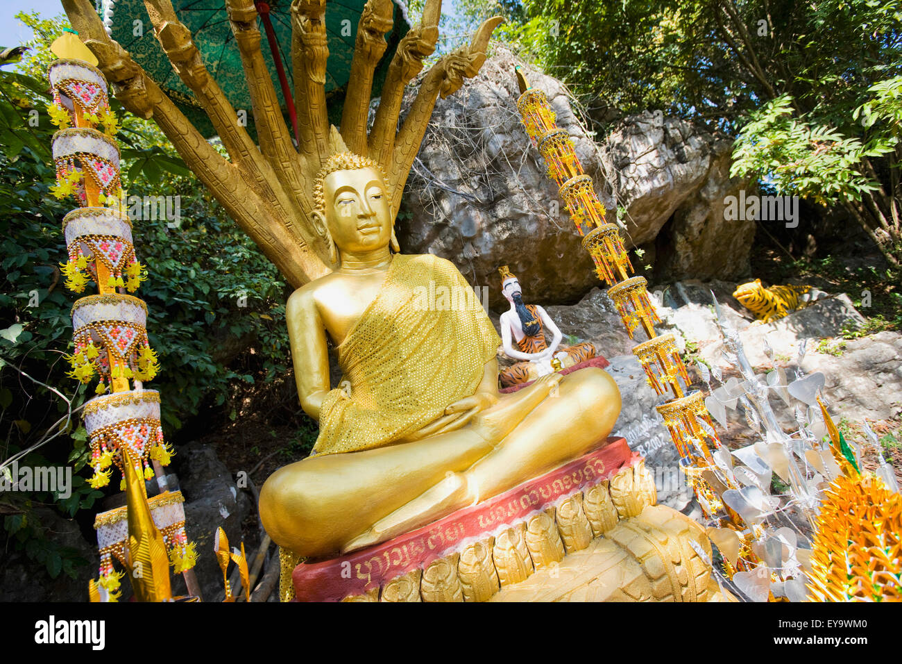 Statue Of Buddha On Phu Si Hill Stock Photo - Alamy