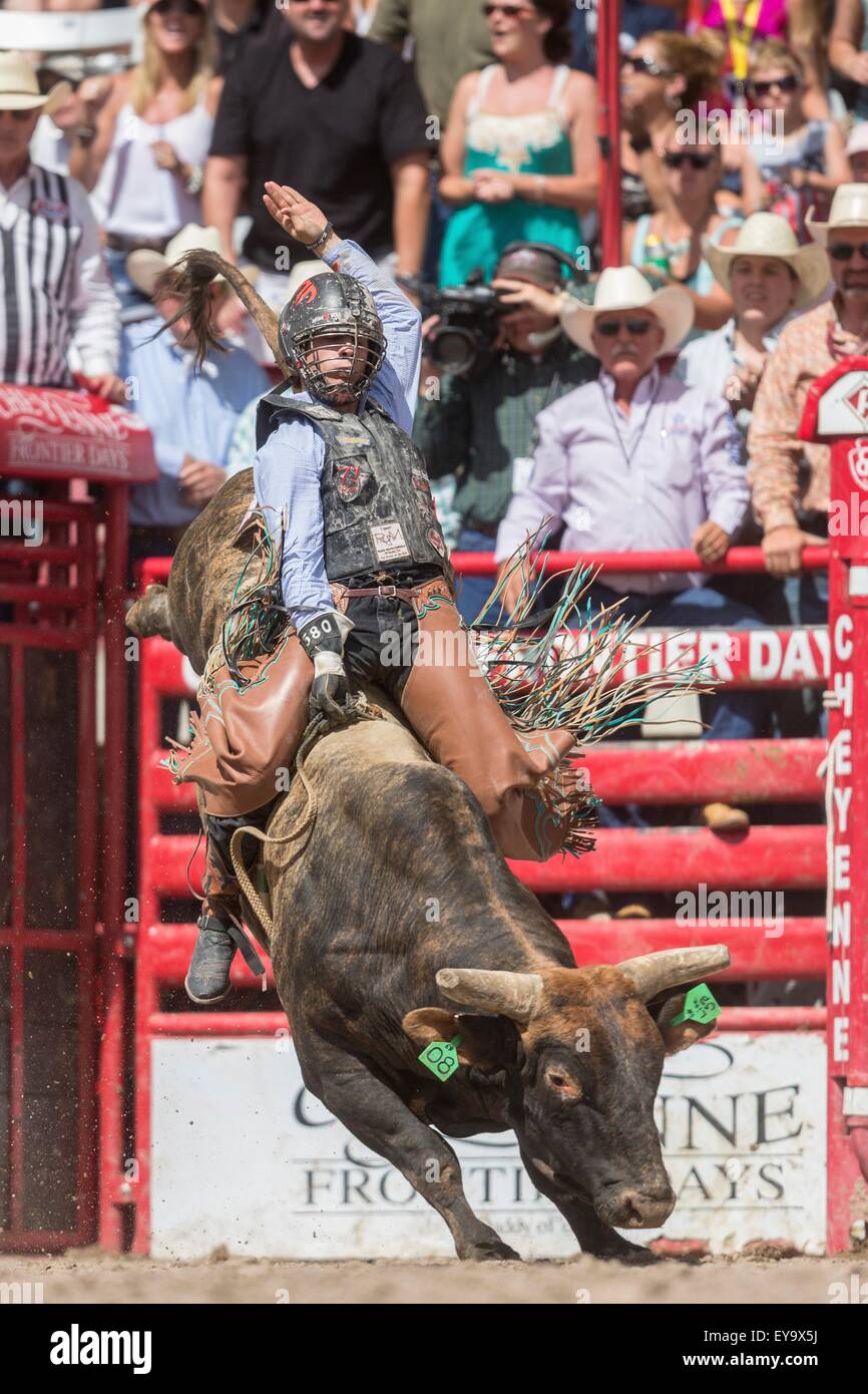 Cheyenne, Wyoming, USA. 24th July, 2015. Bull rider Sage Kimzey of ...