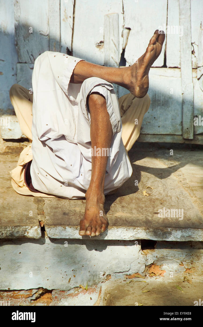 Resting Man And Flies In The Street Stock Photo - Alamy