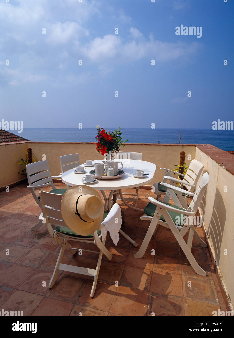 Empty Breakfast Table And Chairs On Balcony Overlooking The Ocean Stock ...