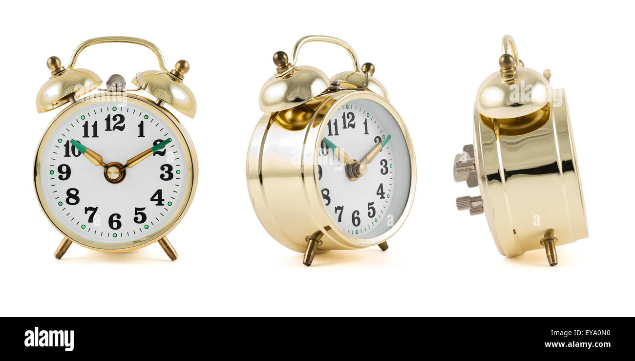 Golden mechanical alarm clock isolated Stock Photo - Alamy