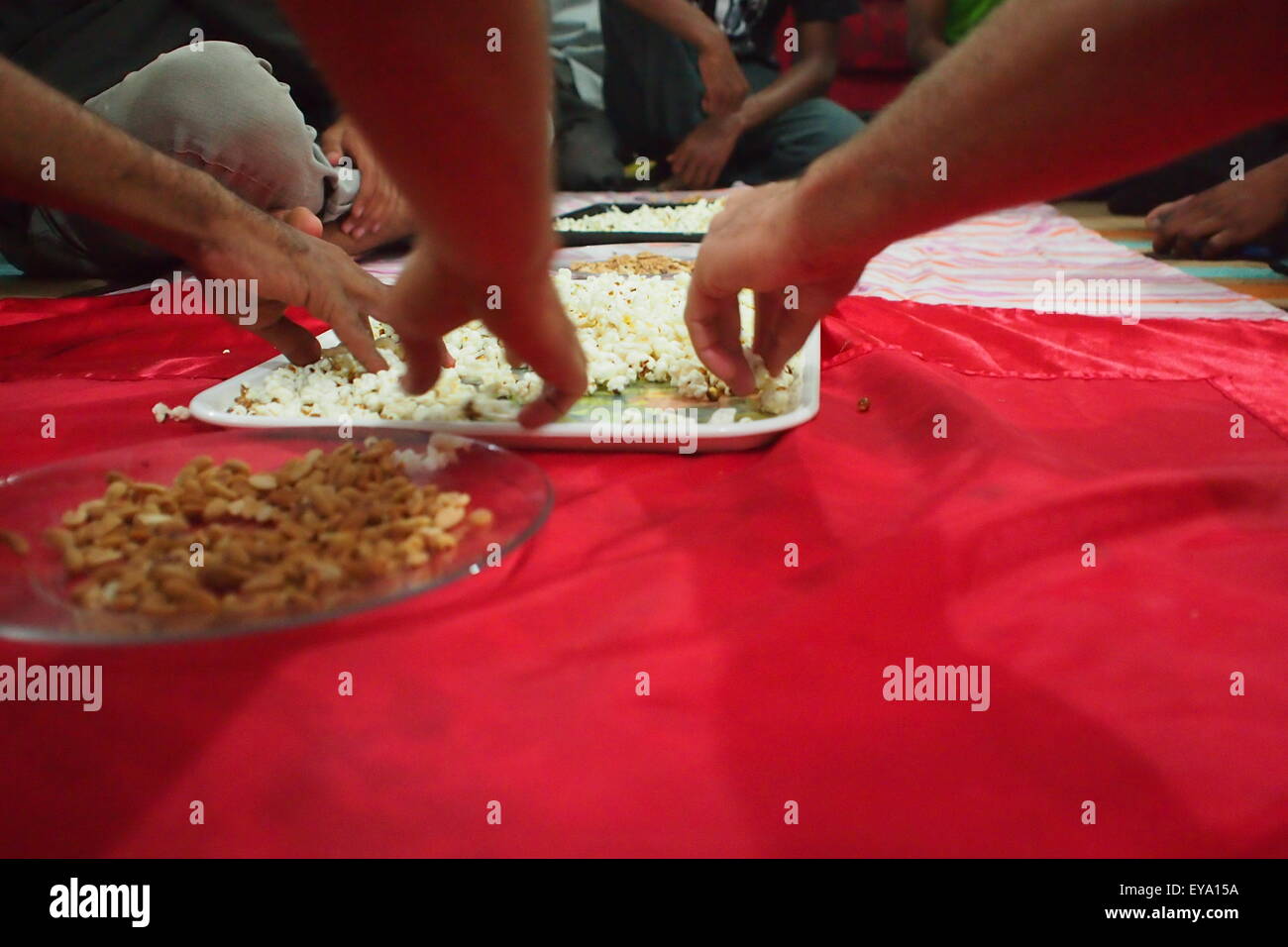 Eating Popcorn In a Group while Sitting Stock Photo - Alamy