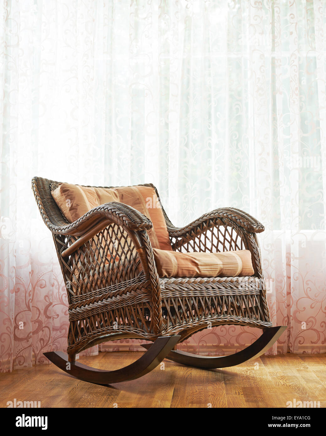 Wicker rocking chair composition Stock Photo - Alamy