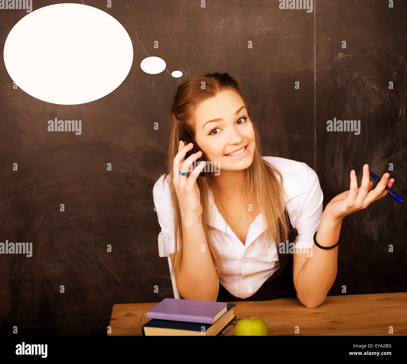 young pretty girl student in classroom at blackboard Stock Photo - Alamy