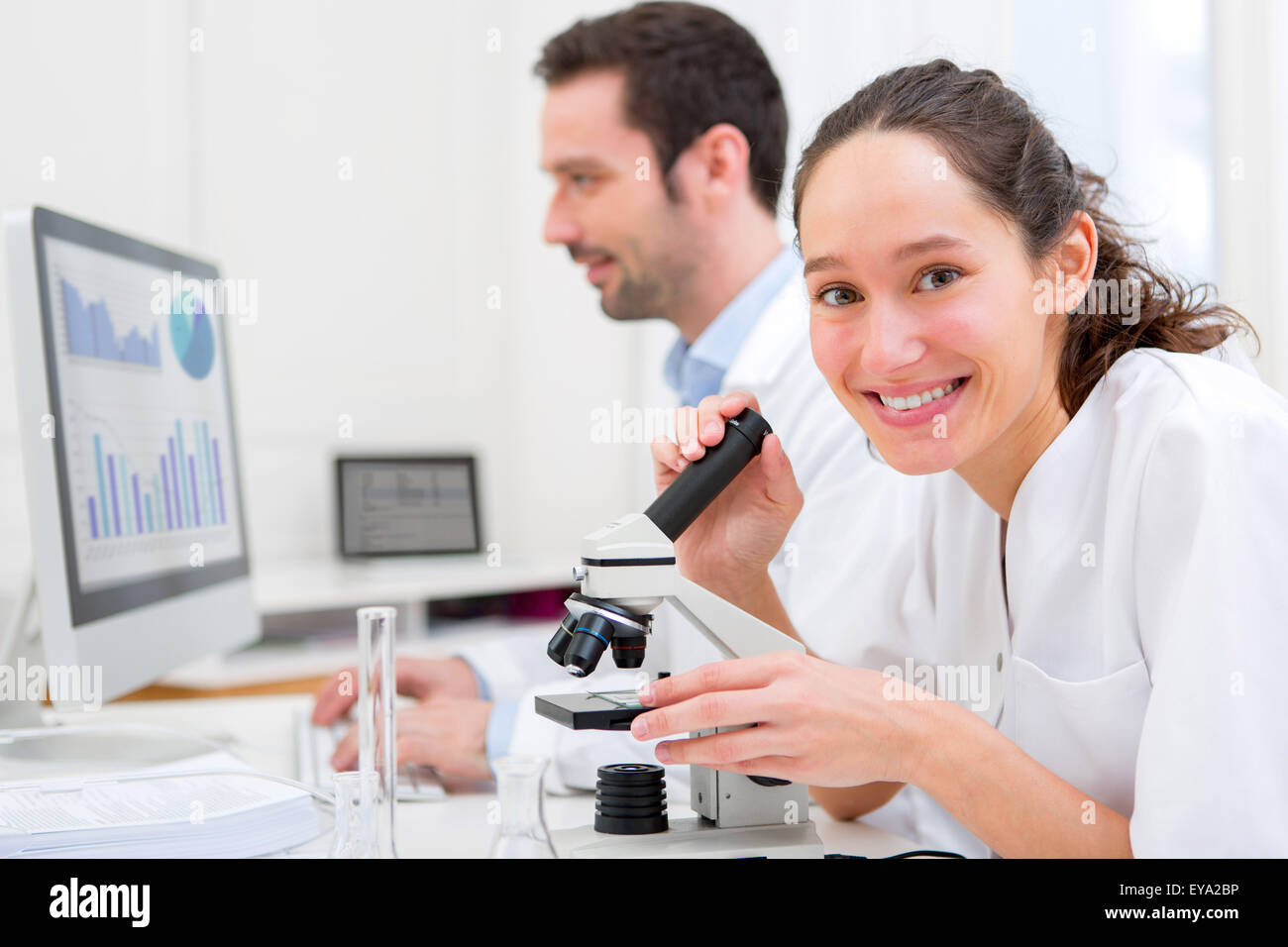 Laptop woman laboratory microscope hi-res stock photography and images ...