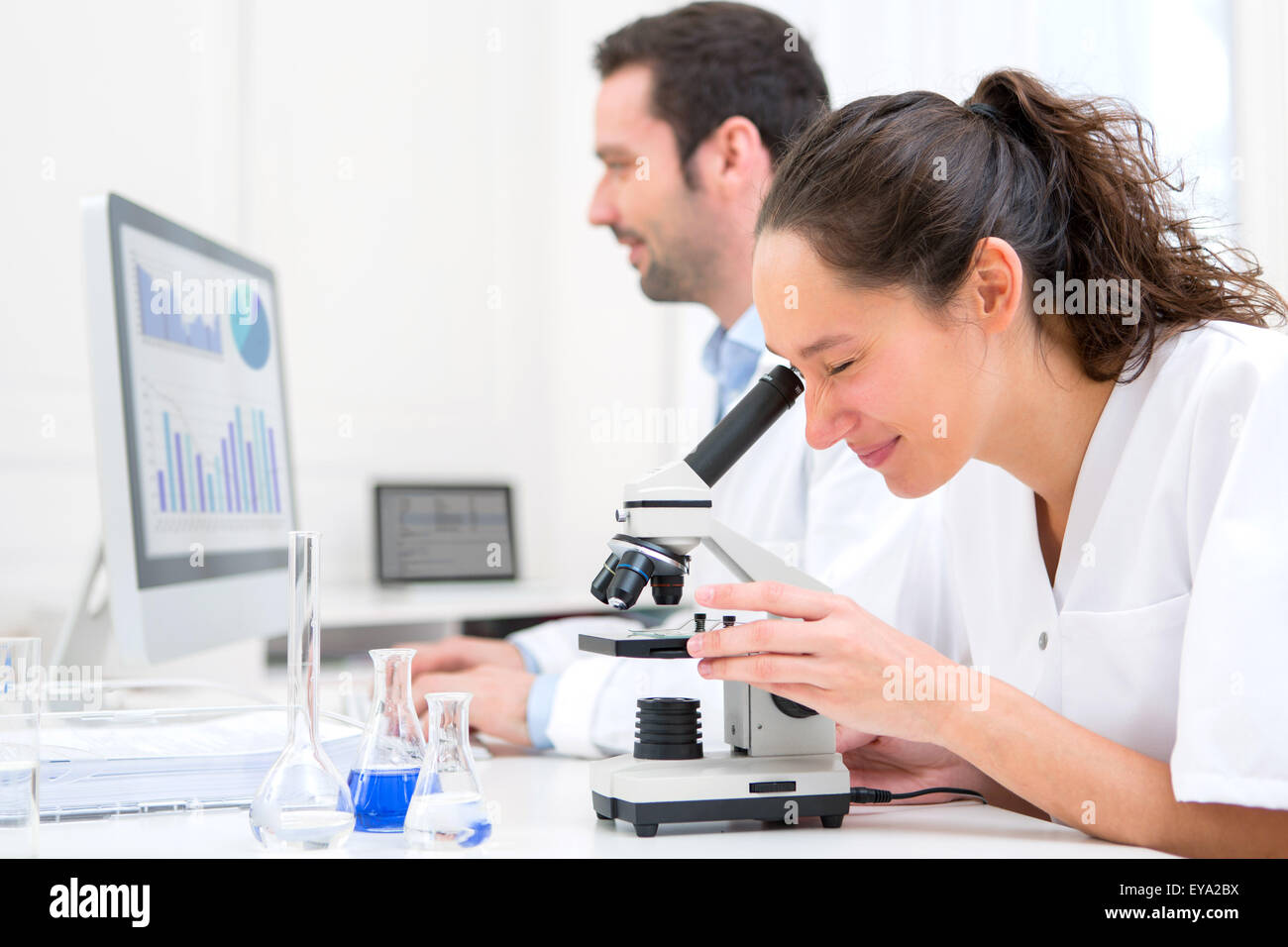 Laptop woman laboratory microscope hi-res stock photography and images ...
