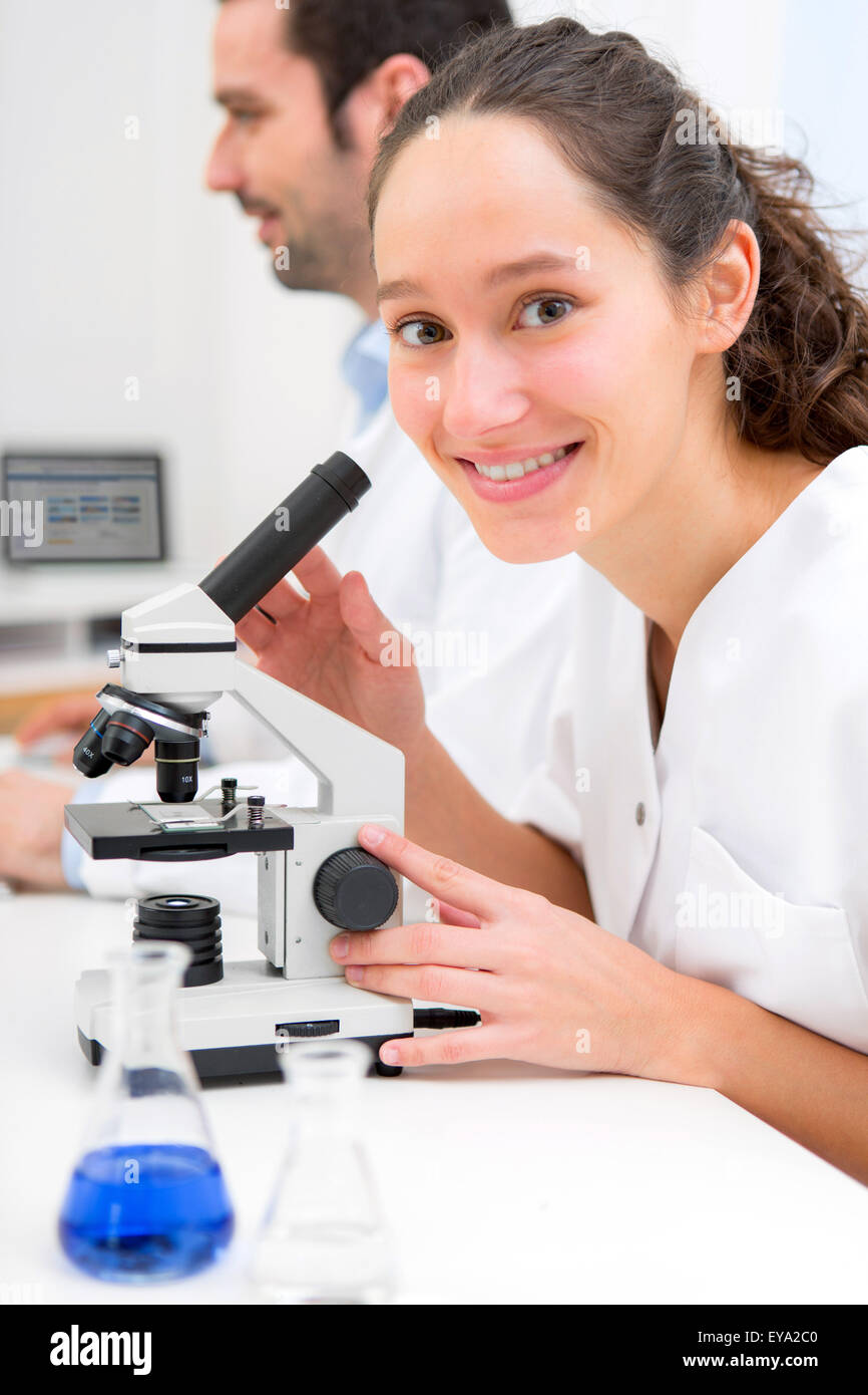 Laptop woman laboratory microscope hi-res stock photography and images ...