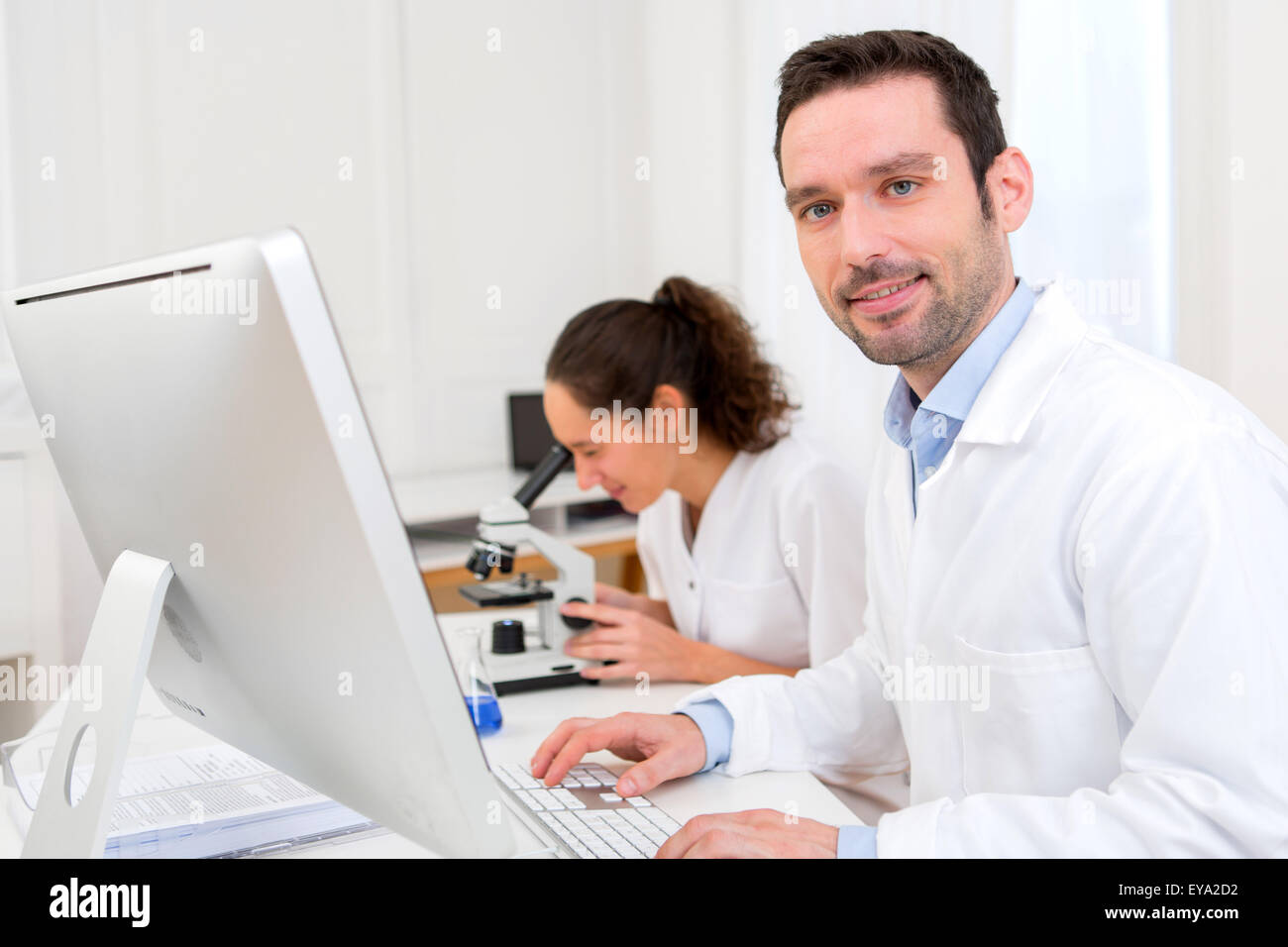 View of Scientists working together in a laboratory Stock Photo - Alamy