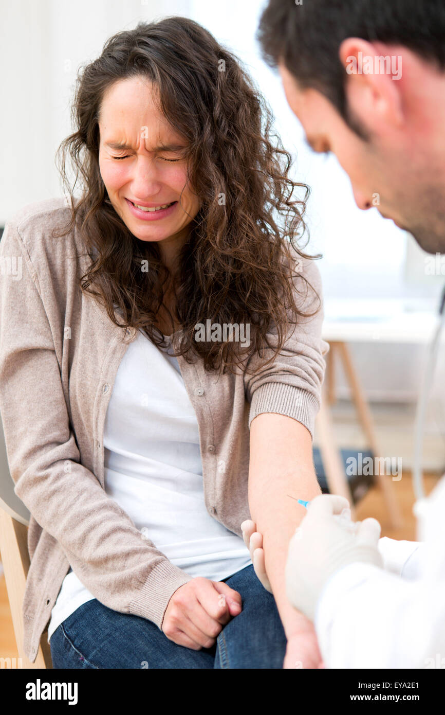 Girl injection pain hi-res stock photography and images - Alamy