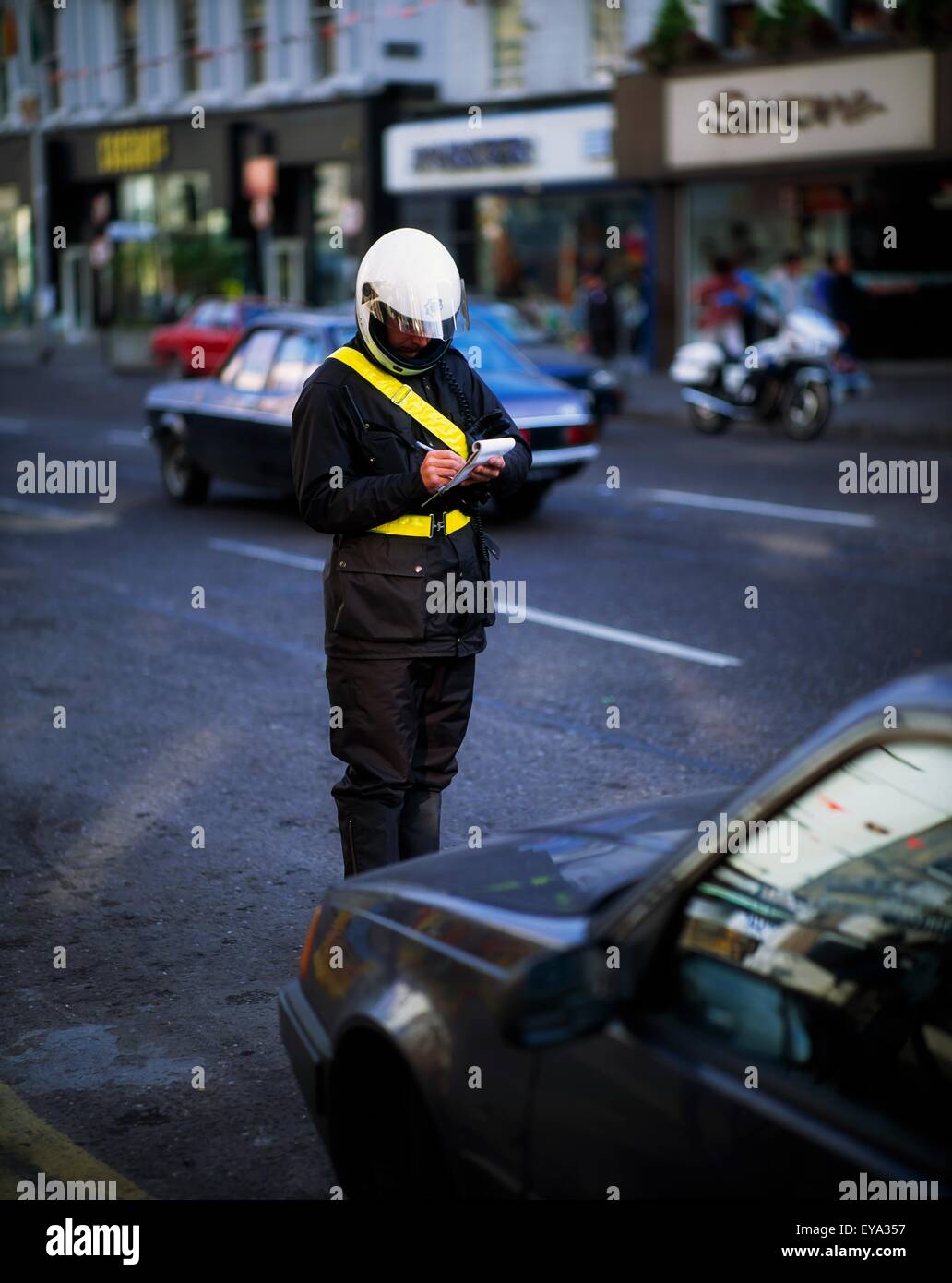 Traffic Garda, Ireland; Police Officer Writing A Ticket Stock Photo - Alamy