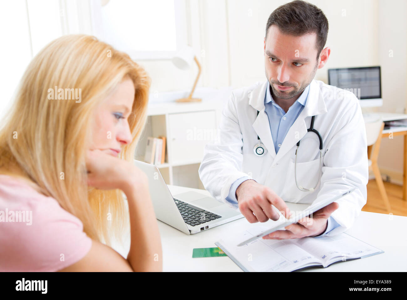Doctor with patient tablet hi-res stock photography and images - Alamy