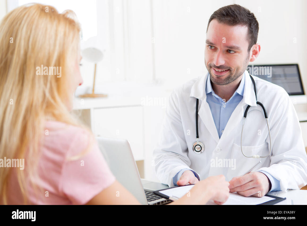 Patient doctor taking notes hi-res stock photography and images - Alamy