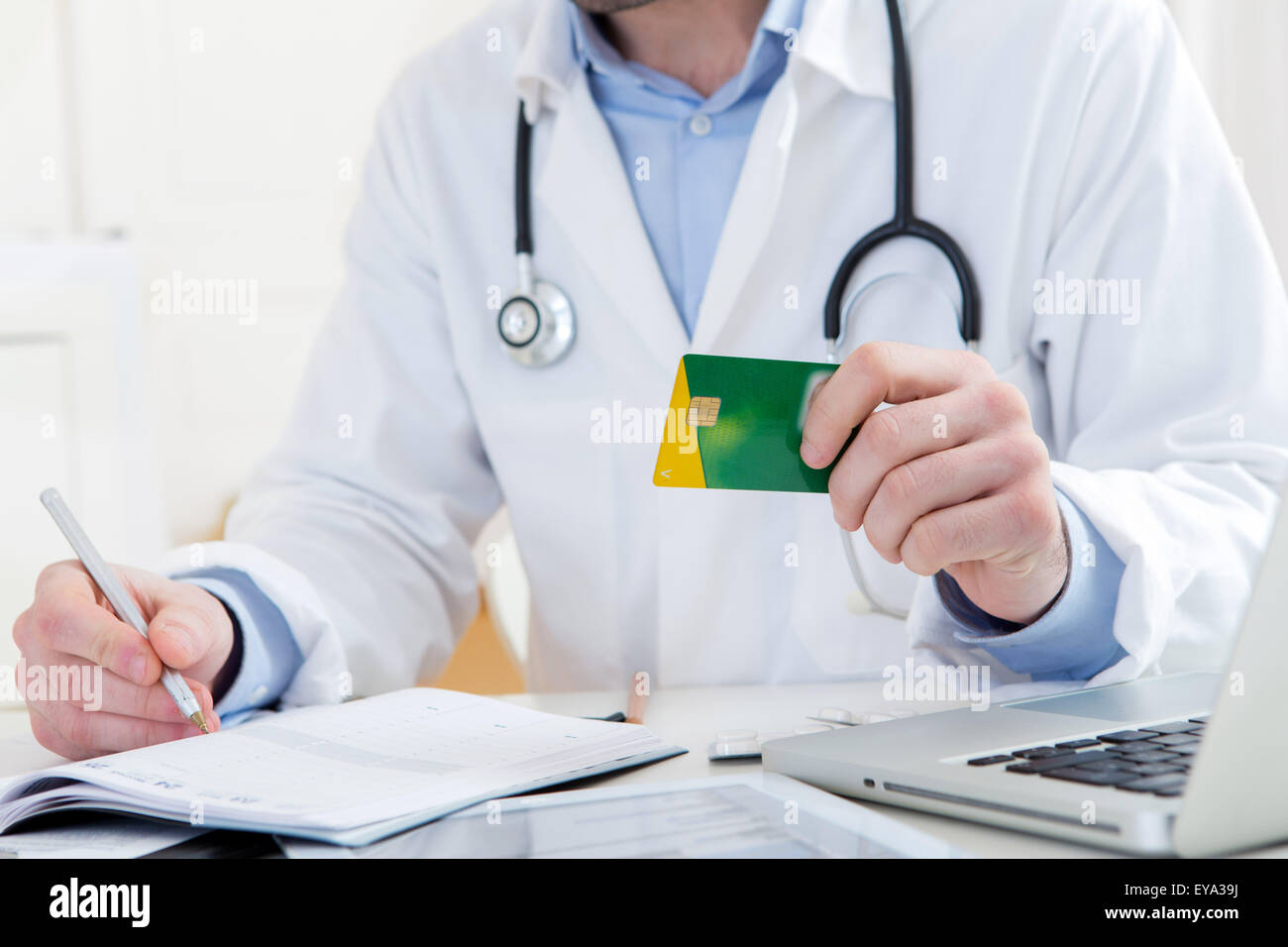 View of a Young attractive doctor taking health insurance card Stock ...
