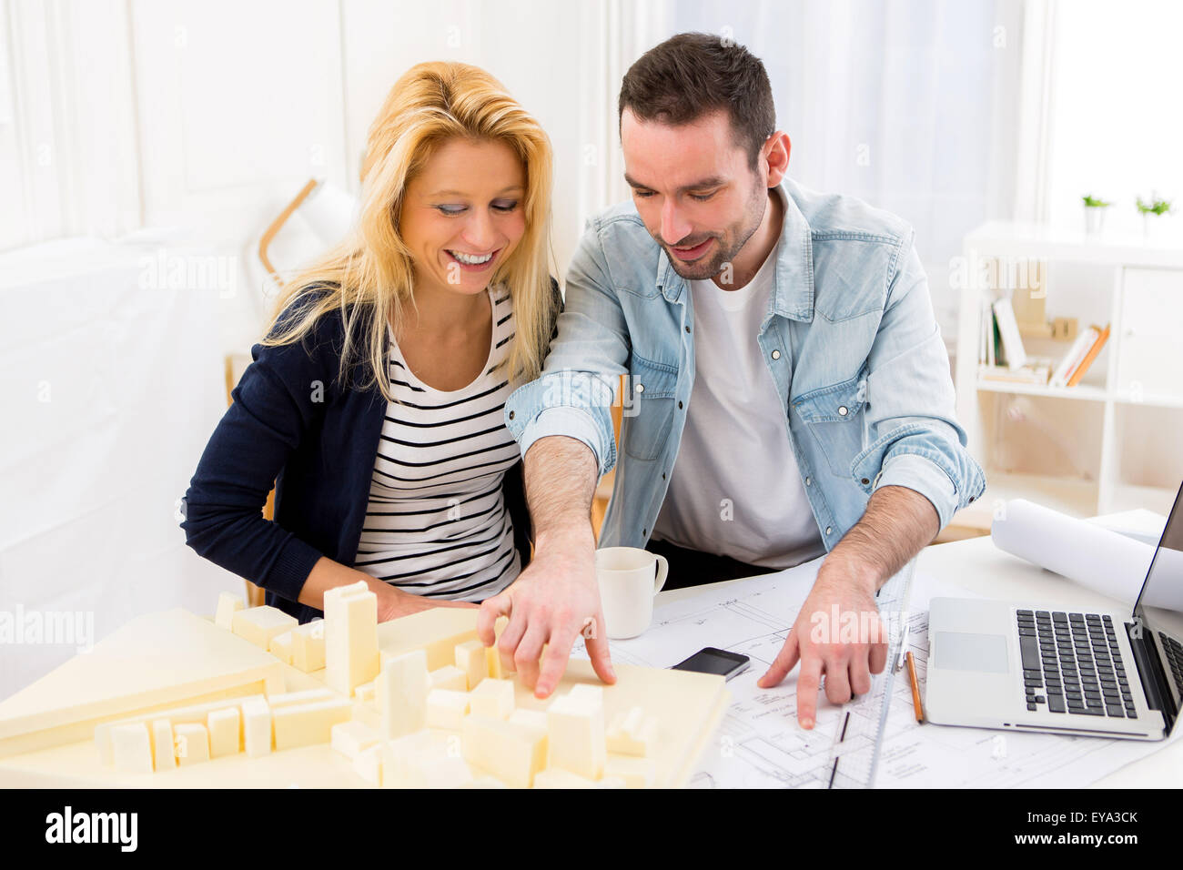 View of Two attractives architect working at the office Stock Photo - Alamy