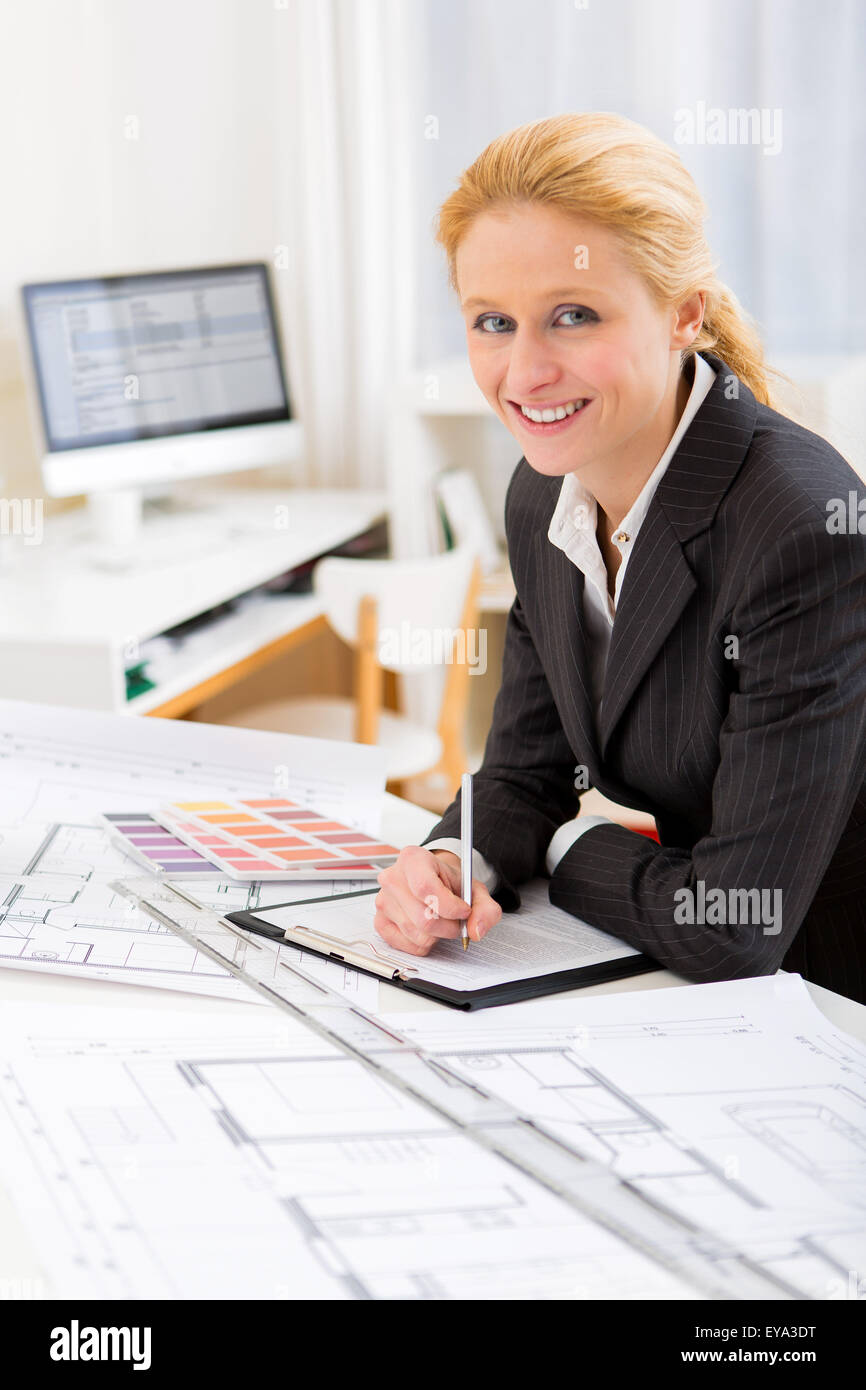 View of a Young attractive engineer working at the office Stock Photo ...