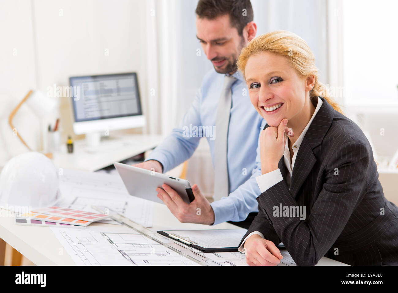 View of a Young attractive engineer working at the office Stock Photo ...