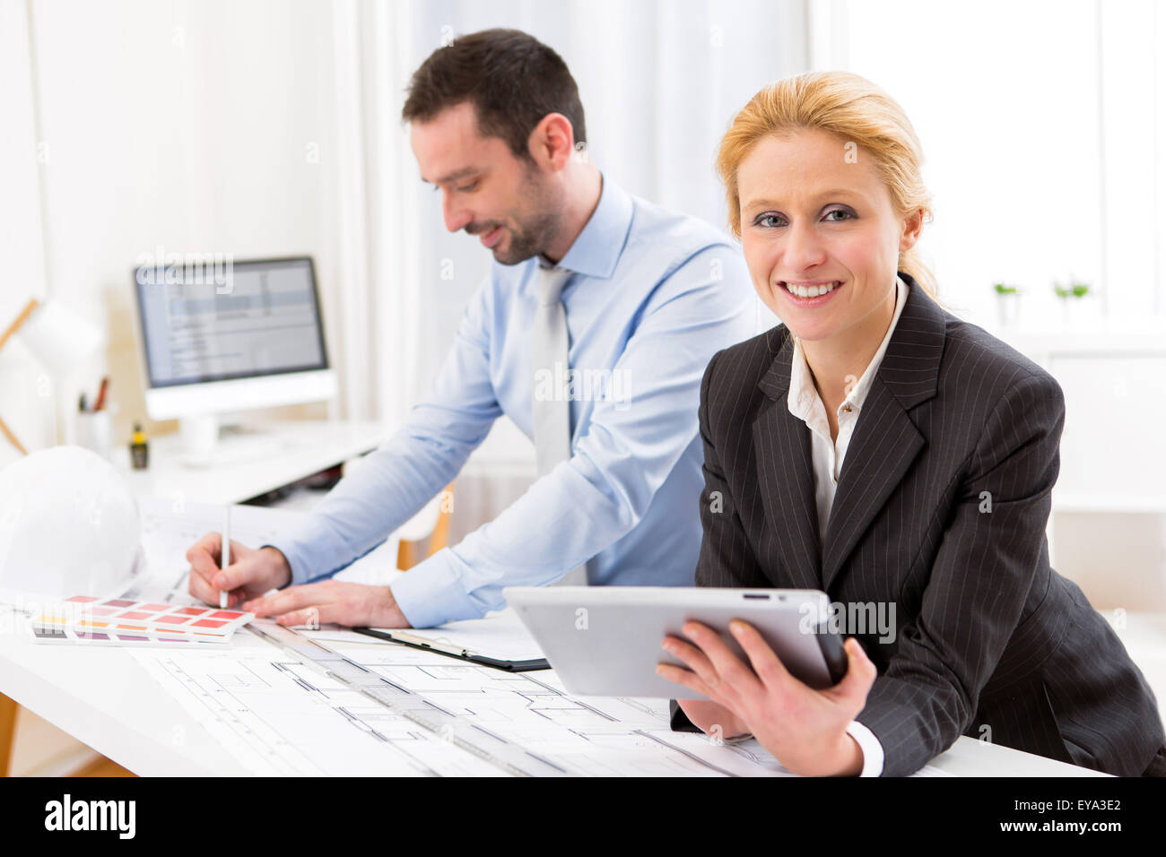 View of a Young attractive engineer working at the office Stock Photo ...