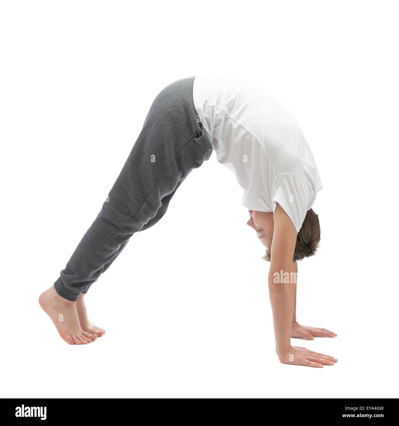 Young boy stretching or doing yoga Stock Photo - Alamy