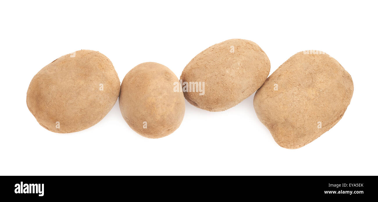 Four brown potatoes lined up Stock Photo - Alamy