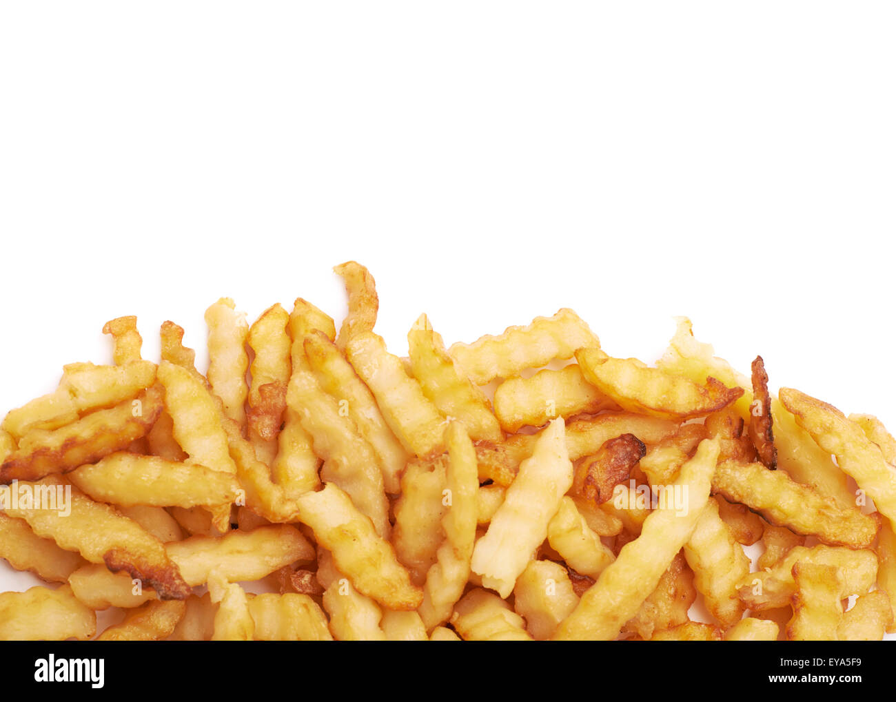 Pile of multiple wavy french fries isolated Stock Photo - Alamy