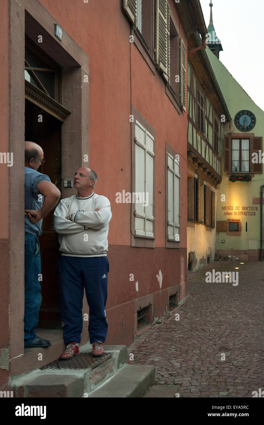 Kaysersberg, France, men standing on a doorstep and chat Stock Photo ...
