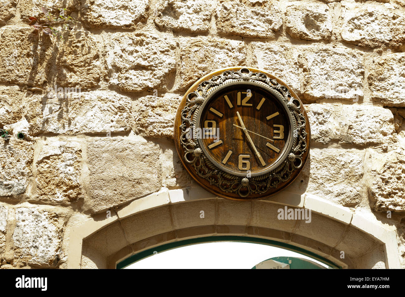 Old clock above the entrance to the old house Stock Photo - Alamy
