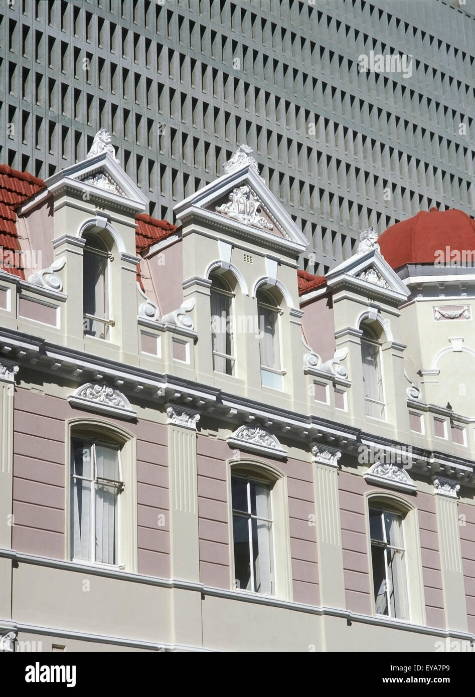 Old Colonial Building In Front Of Large Modern Concrete Office Block ...