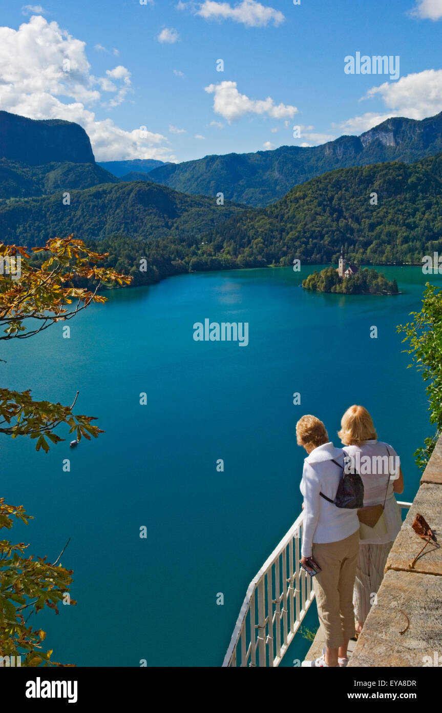 Two Tourists Looking At Lake Bled From Castle Terrace Stock Photo - Alamy
