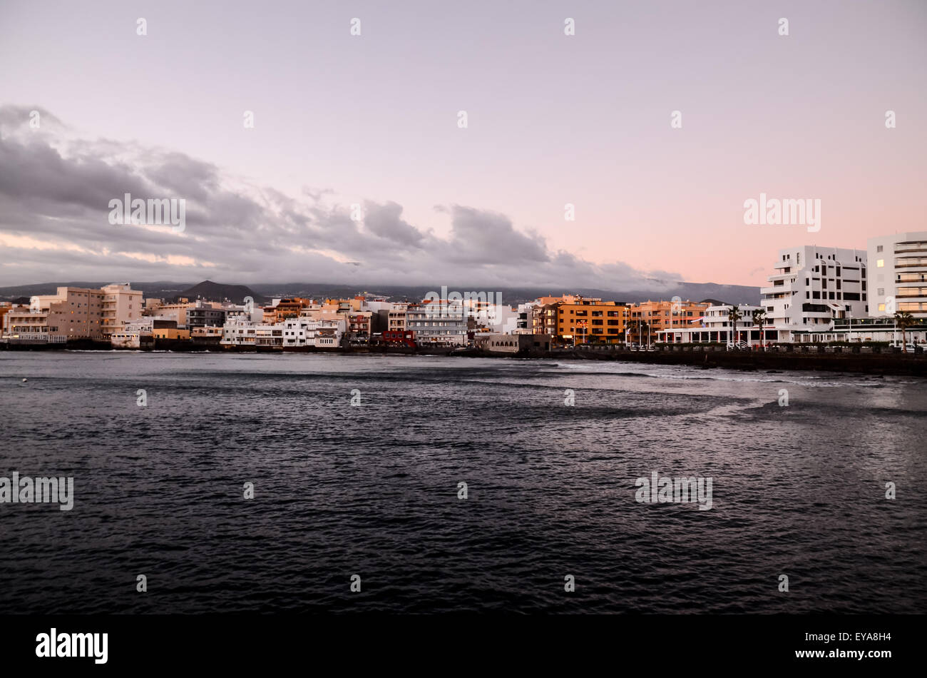 Sea and Building at Sunset Stock Photo - Alamy