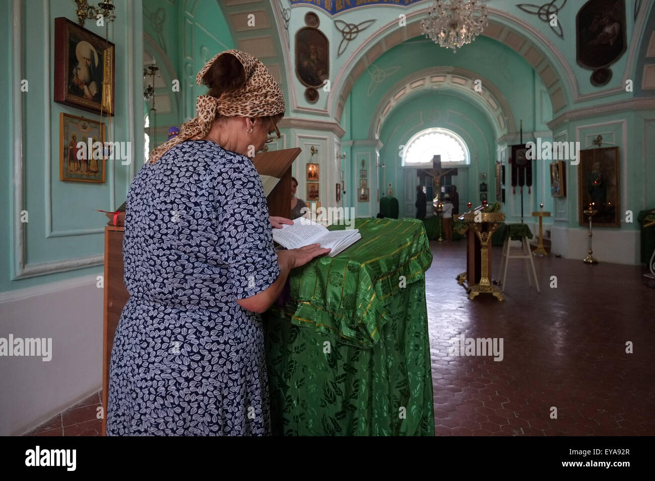 An Orthodox Christian worshiper reading the bible inside the Alexander ...